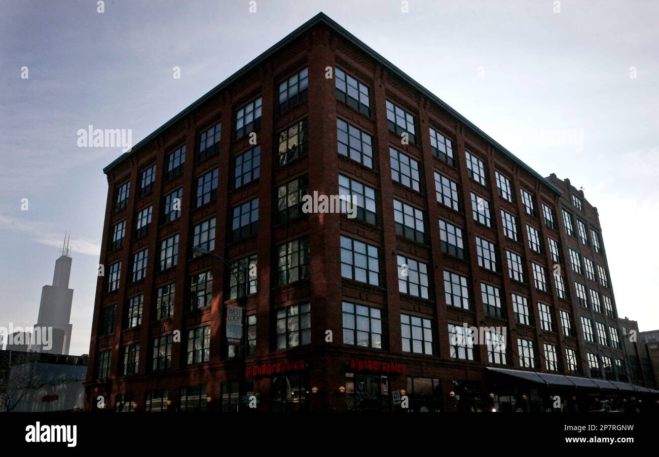 The Willis Tower, at left, is dwarfed by a reclaimed warehouse ...