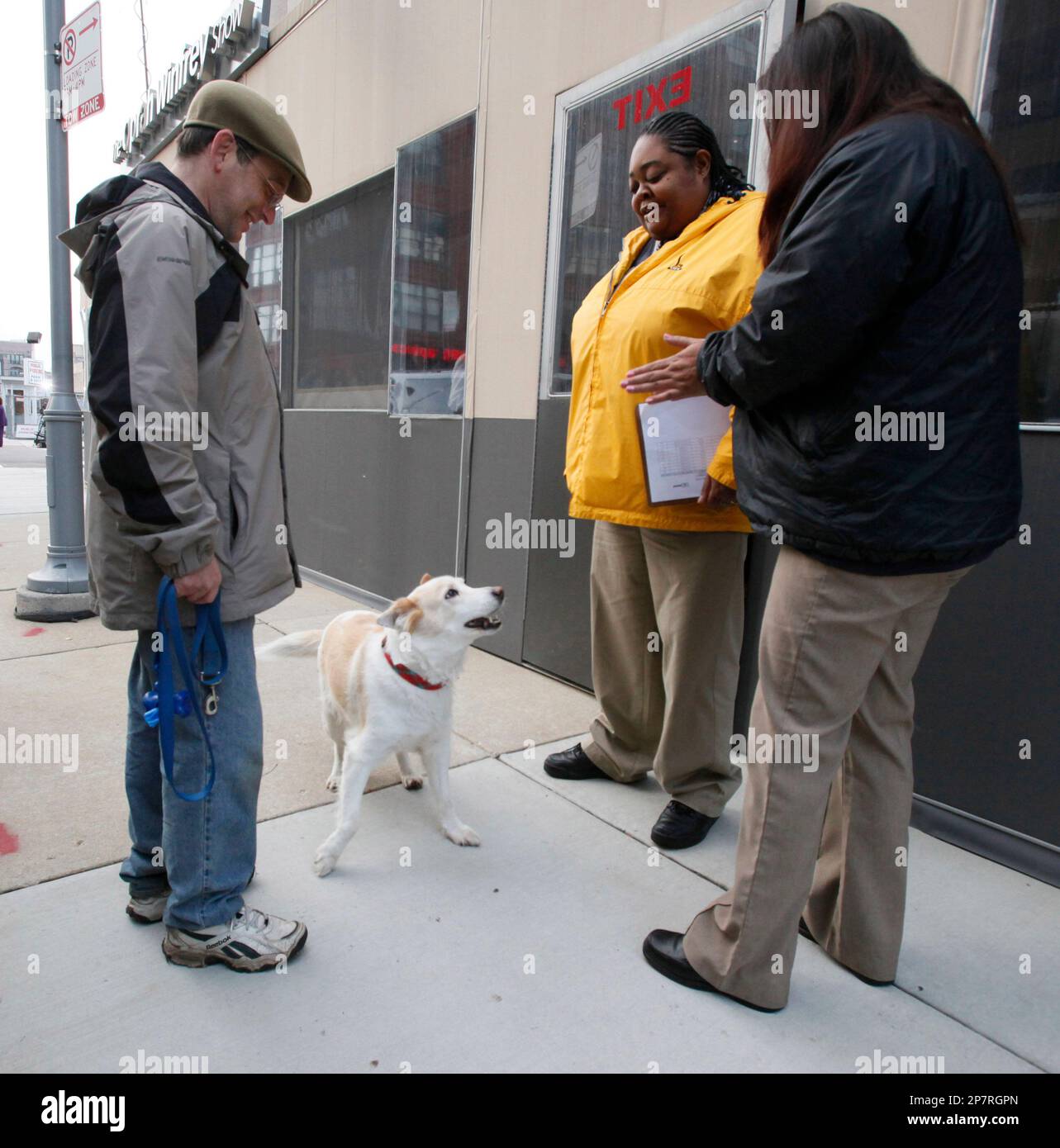 Ed Samuelson walks his dog, Lola, and chats with employees Friday, Nov ...