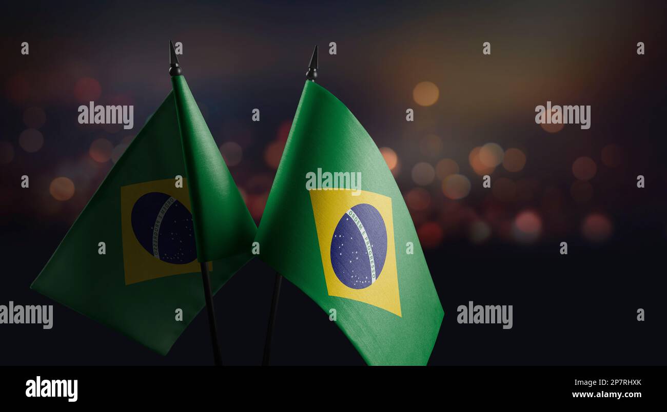 Small flags of the Brazil on an abstract blurry background Stock Photo ...