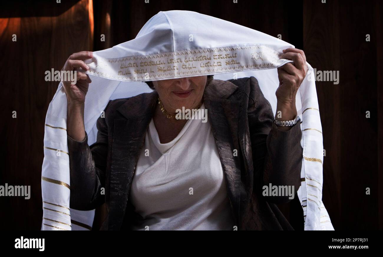 Polish-Israeli Zipora Livneh, puts a prayer shawl over her head as she ...