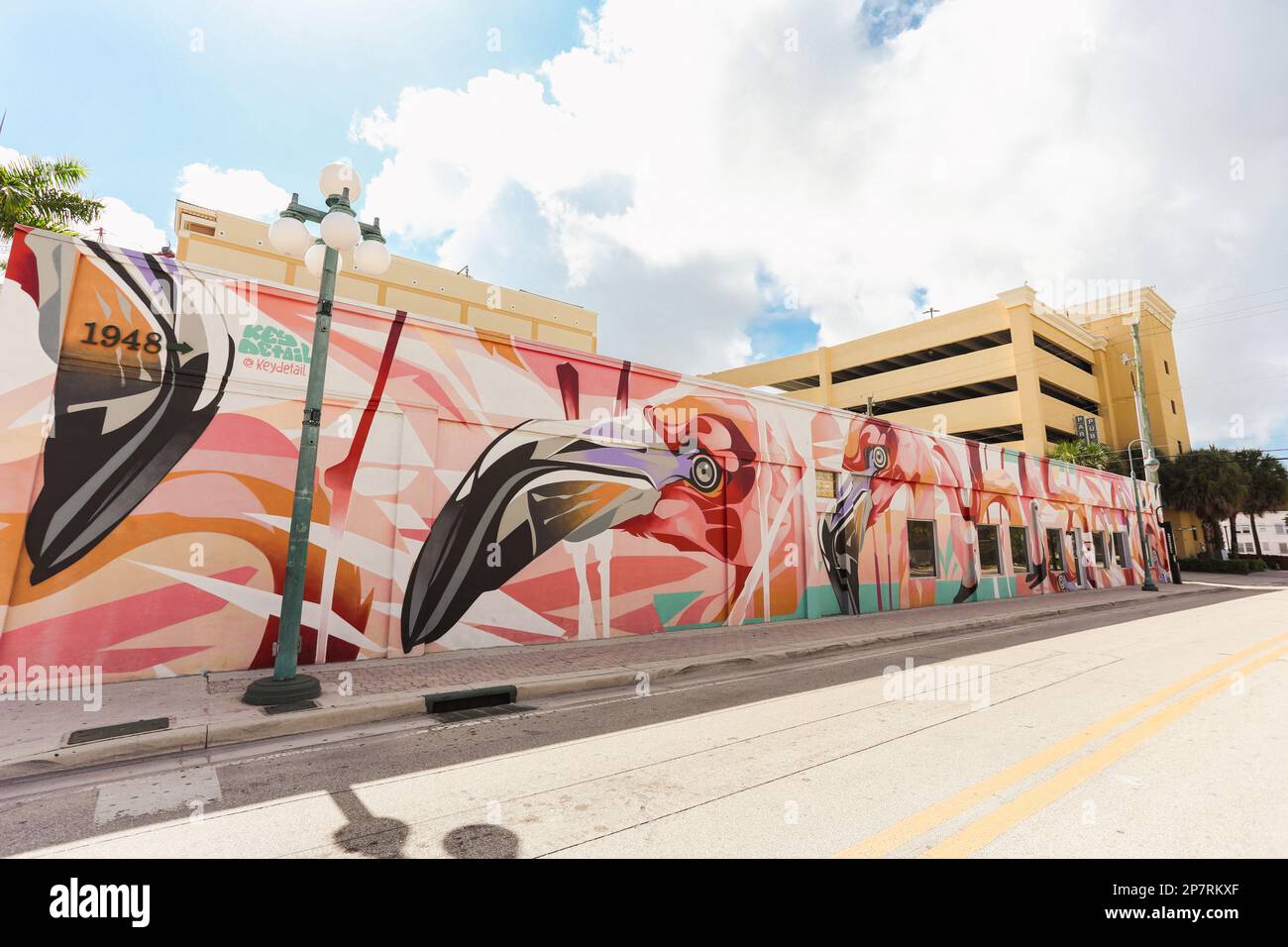 A flamingo mural lines the side of a building downtown near the ArtsPark at Young Circle in ...