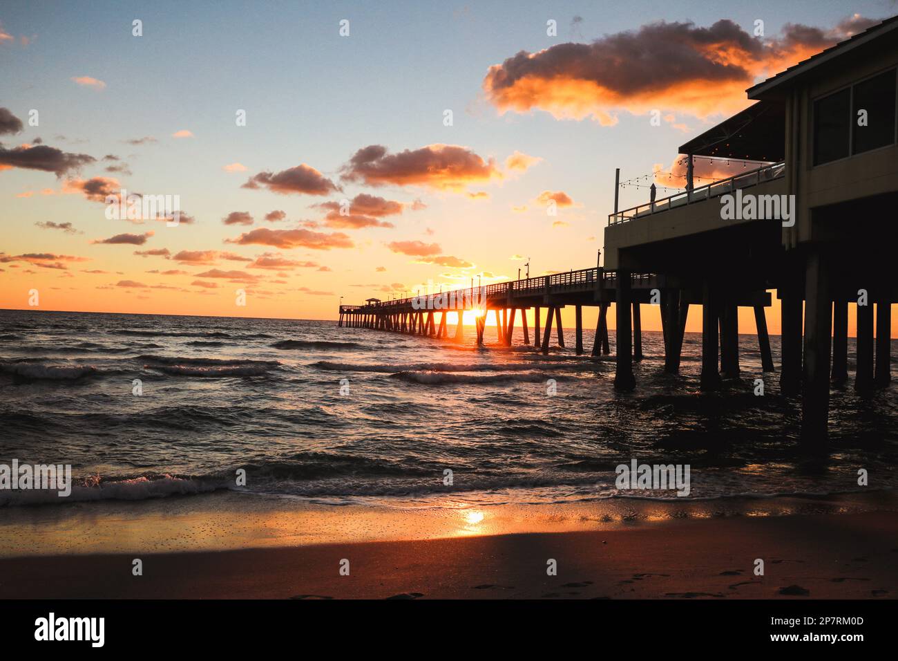 The Dania Beach Fishing Pier at sunrise in Dania Beach, Florida Stock ...