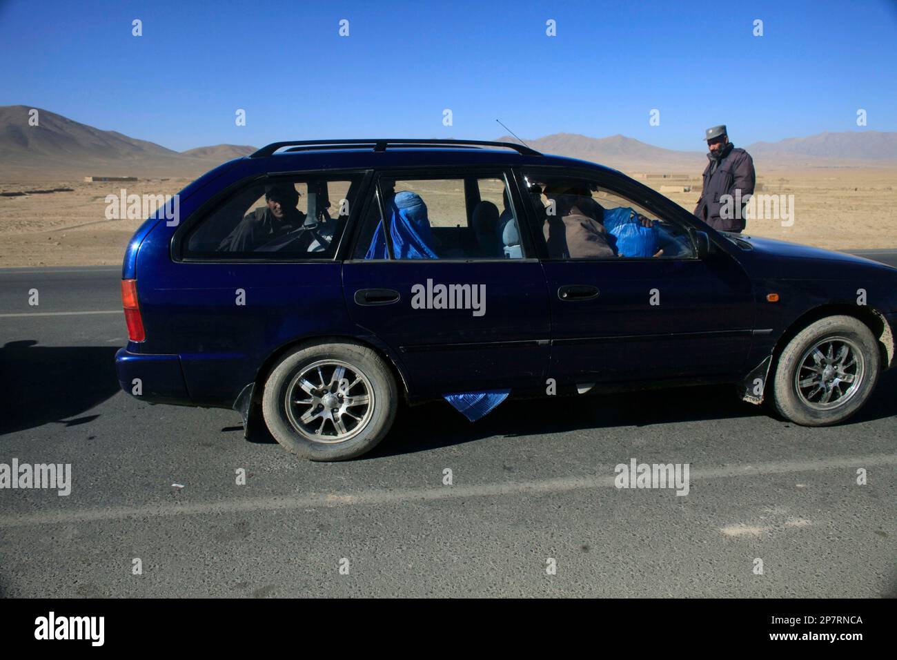 A car arrives at a security checkpoint near the town of Balisal Afghan ...