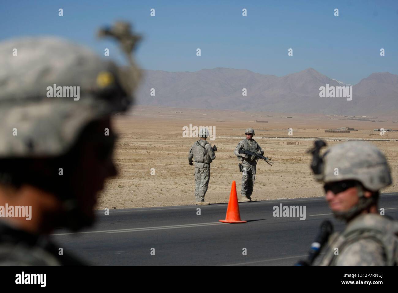U.S. Army soldiers of the 118th Airborne MP Company man a checkpoint ...