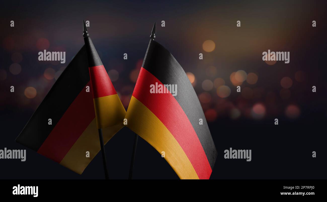 Small flags of the Germany on an abstract blurry background Stock Photo ...