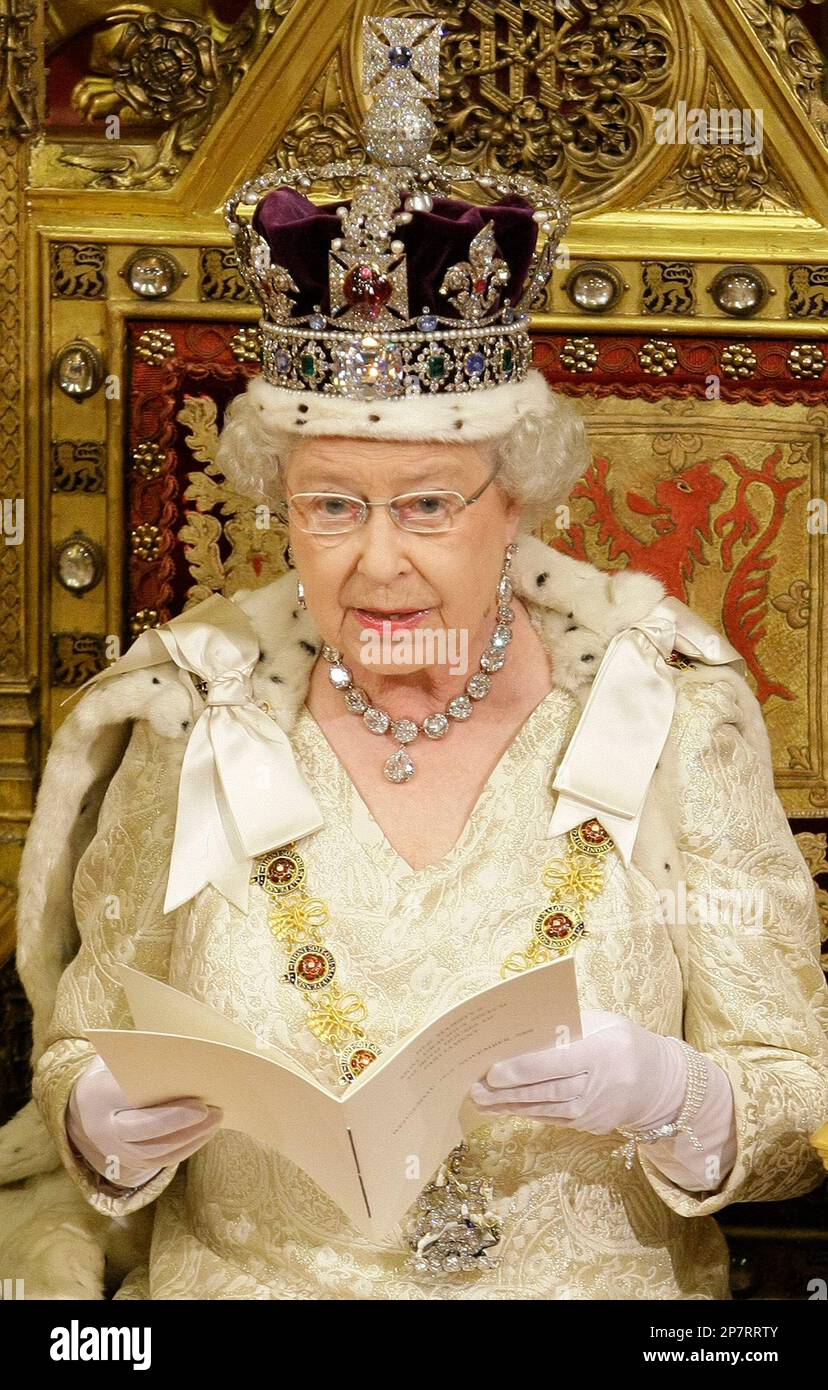 Britain's Queen Elizabeth II looks up as she delivers her speech, which ...