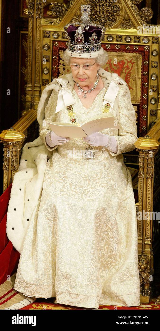 Britain's Queen Elizabeth II looks up as she delivers her speech, which ...