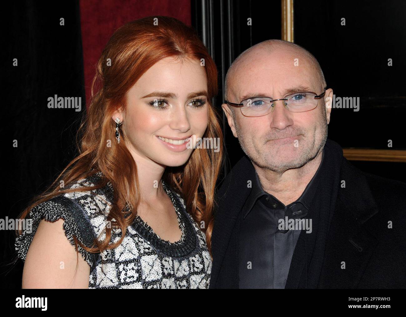 Actor Lily Collins, left and her father Phil Collins attend the Warner ...