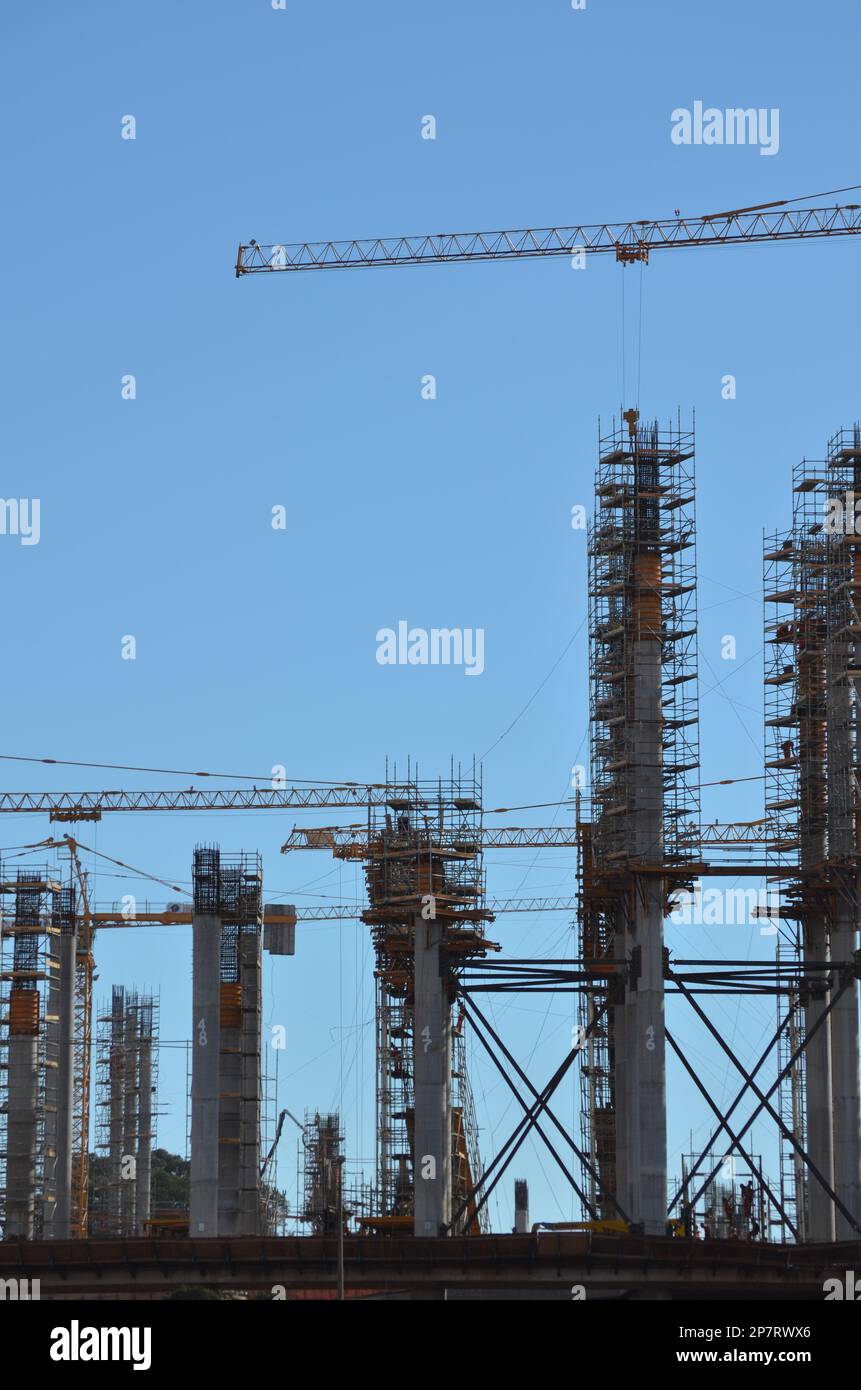 Image depicts large construction site with machinery and structures on ...
