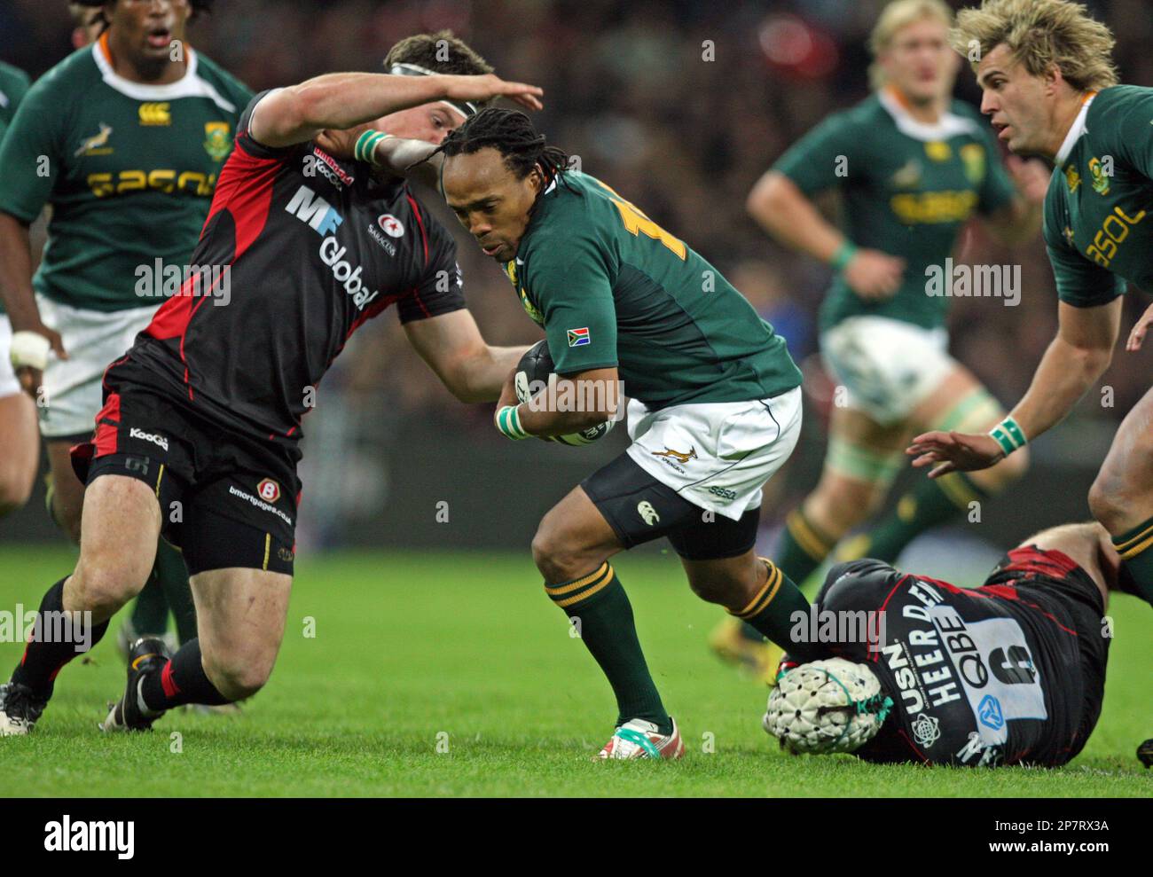 Saracens' Wikus van Heerden, right, and Andy Saull, left, tackle South ...