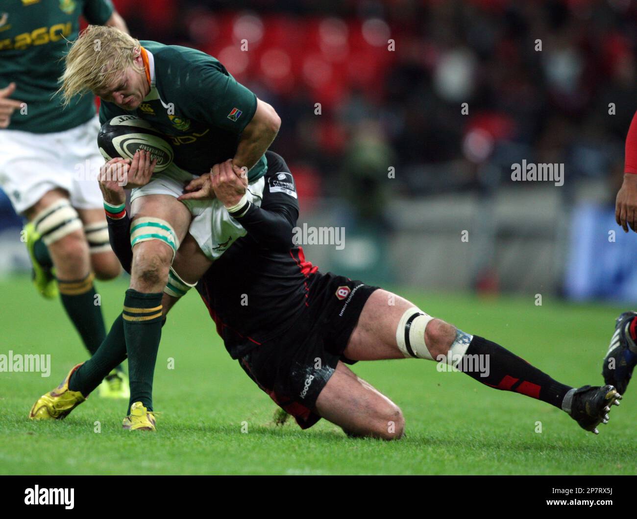Saracens' Wikus van Heerden, right, tackles South Africa's Dewald ...