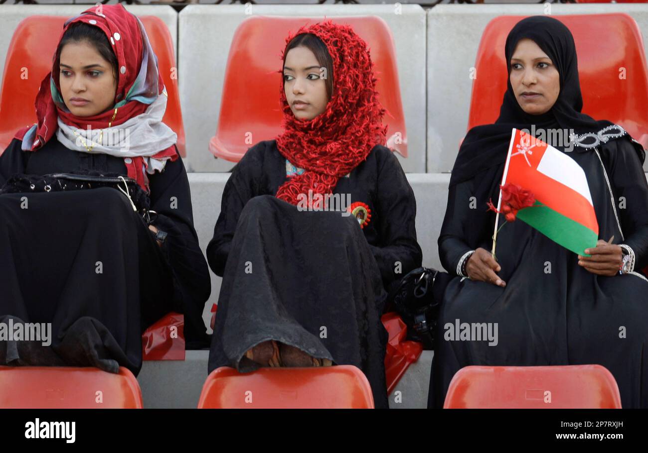 Omani female soccer fans one with Oman national flag watch the Brazil ...