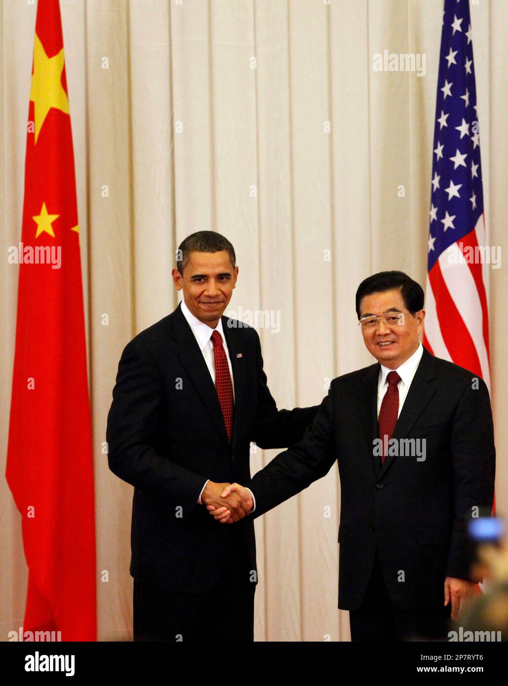 U.S. President Barack Obama, left, poses for photographers with Chinese ...