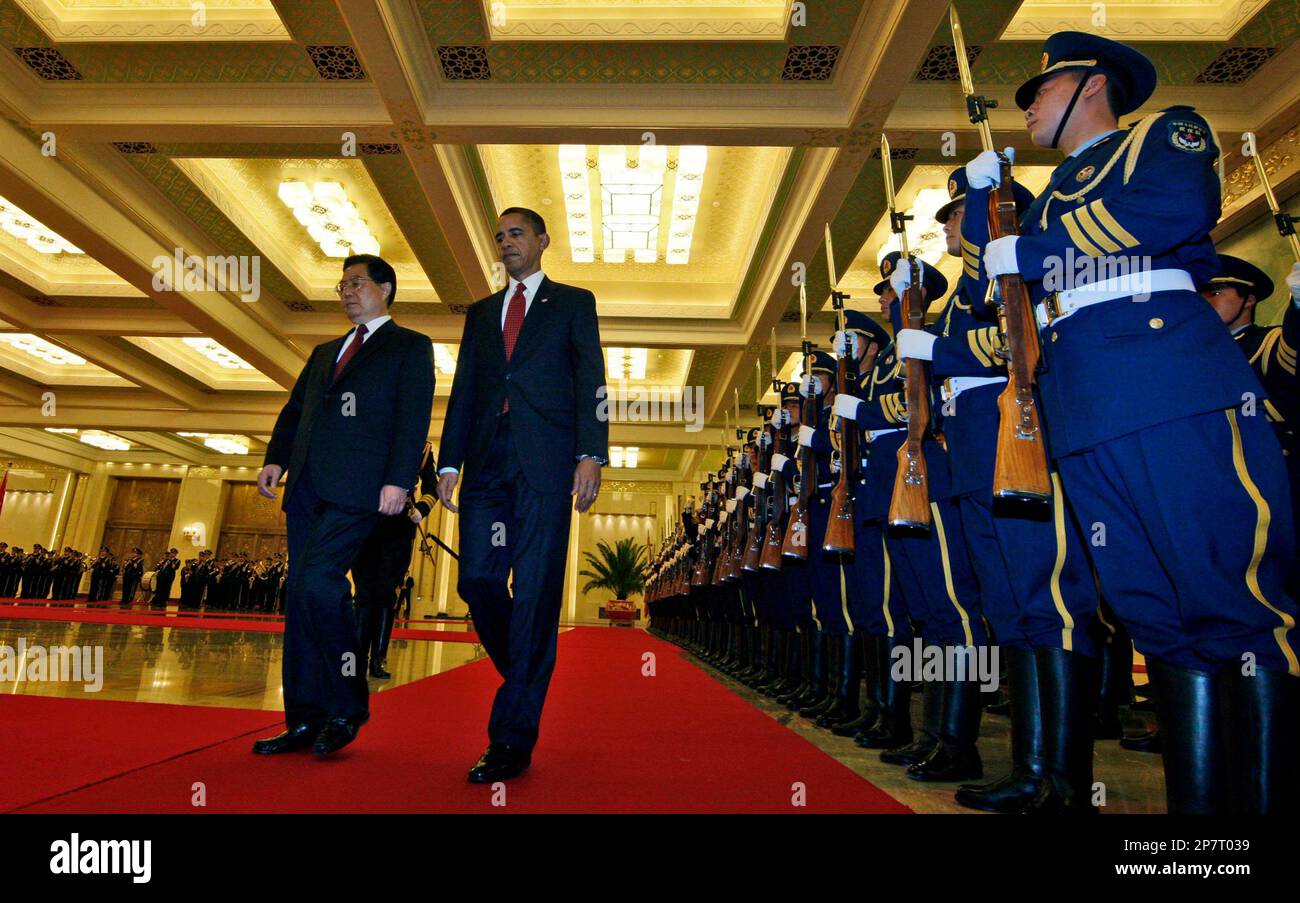 U.S. President Barack Obama, center, walks next to Chinese President Hu ...
