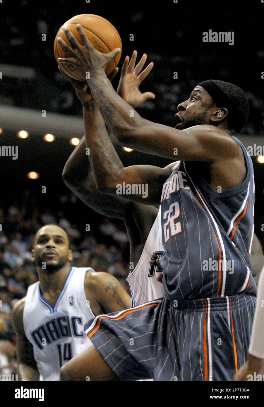 Charlotte Bobcats guard Ronald Murray, right, goes up for a shot in ...