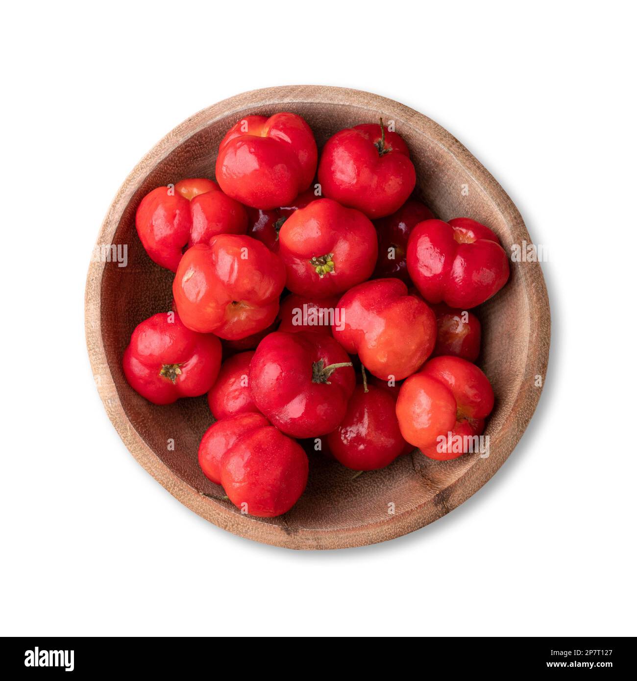 Acerolas or Barbados Cherries in a bowl isolated over white background ...