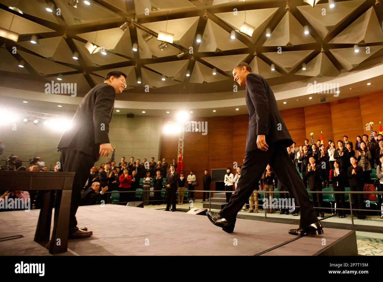 U.S. President Barack Obama (R) arrives for a town hall meeting with ...