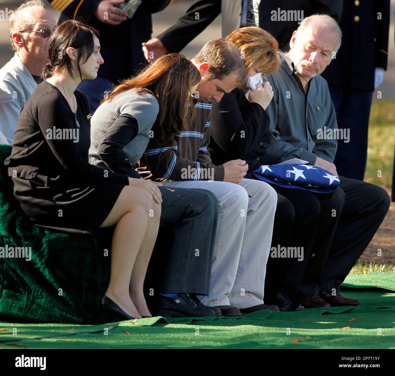 Larry and Sharon Mueller, far right, parents of of Army Sgt. Nickolas A ...