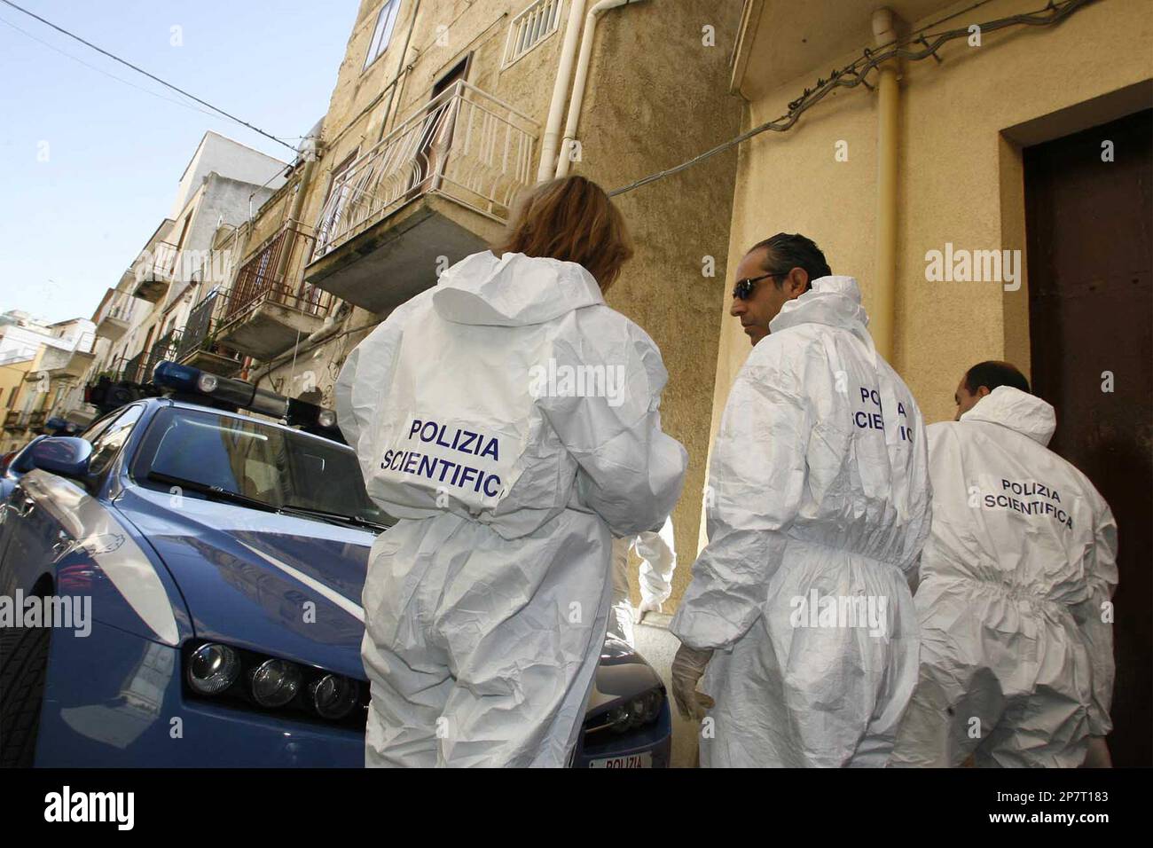 Italian Forensic police officers are seen outside the apartment of ...