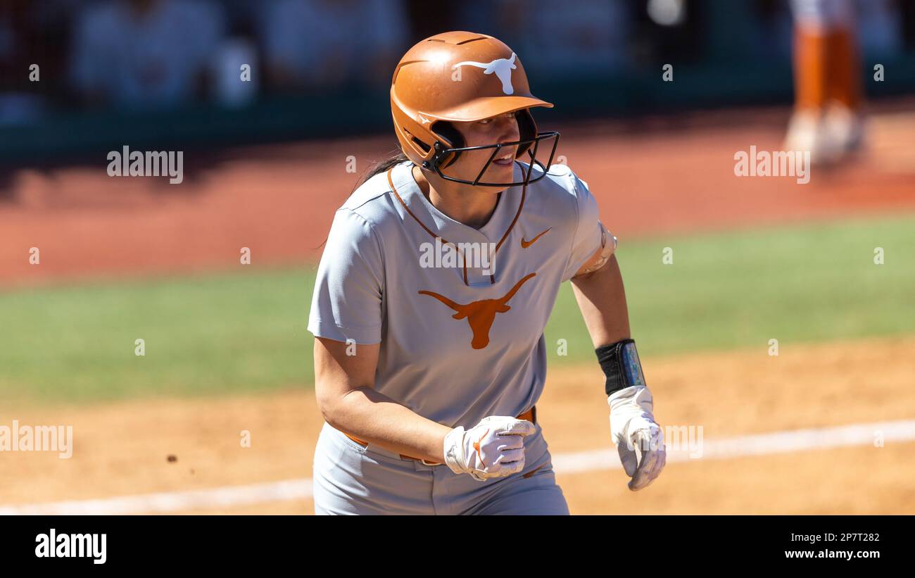 Texas designated player Courtney Day runs to first against McNeese ...