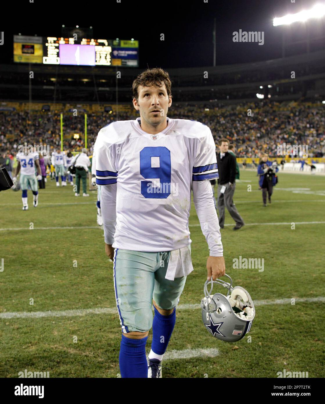 Dallas Cowboys quarterback Tony Romo walks off the field after the ...