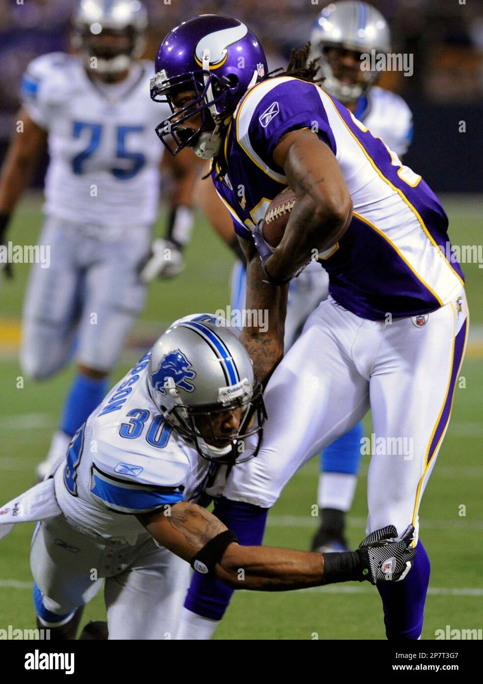 Detroit Lions safety Ko Simpson (30) brings down Minnesota Vikings wide ...
