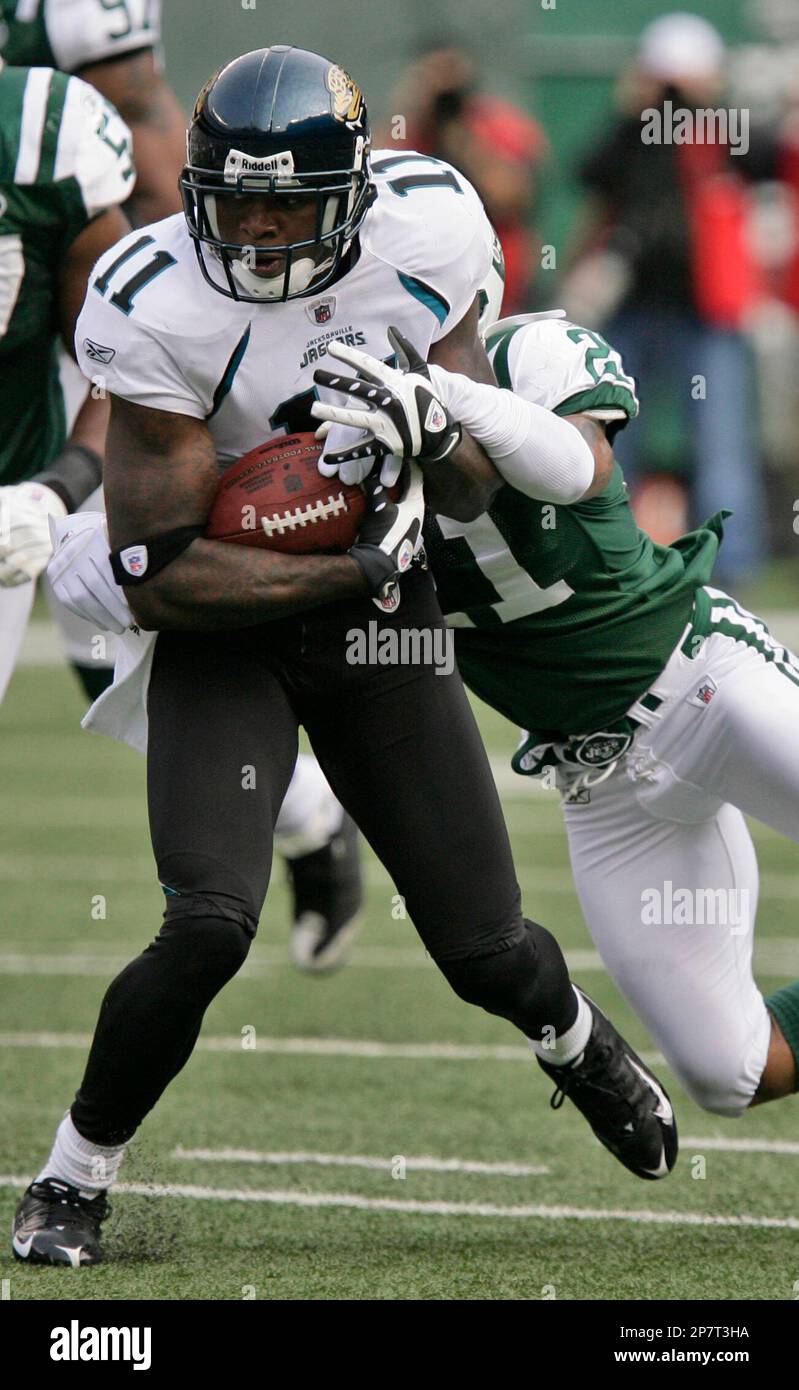 Jacksonville Jaguars wide receiver Mike Sims-Walker (11) is tackled by ...
