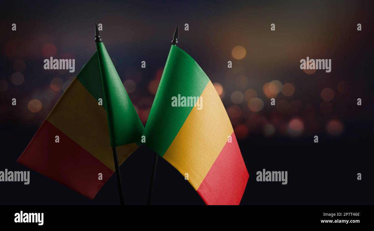 Small flags of the Mali on an abstract blurry background Stock Photo ...