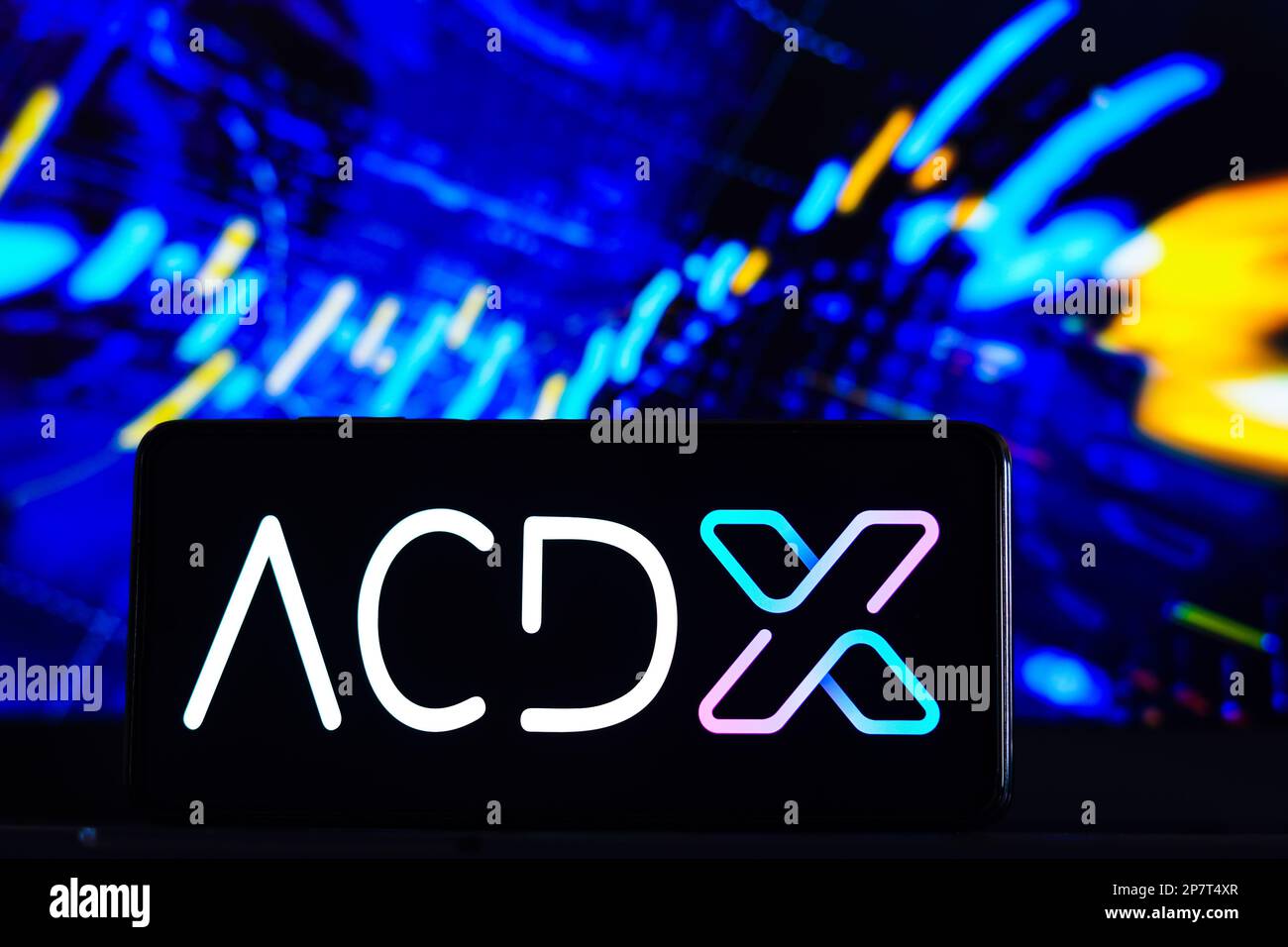 In this photo illustration, the ACDX logo seen displayed on a ...