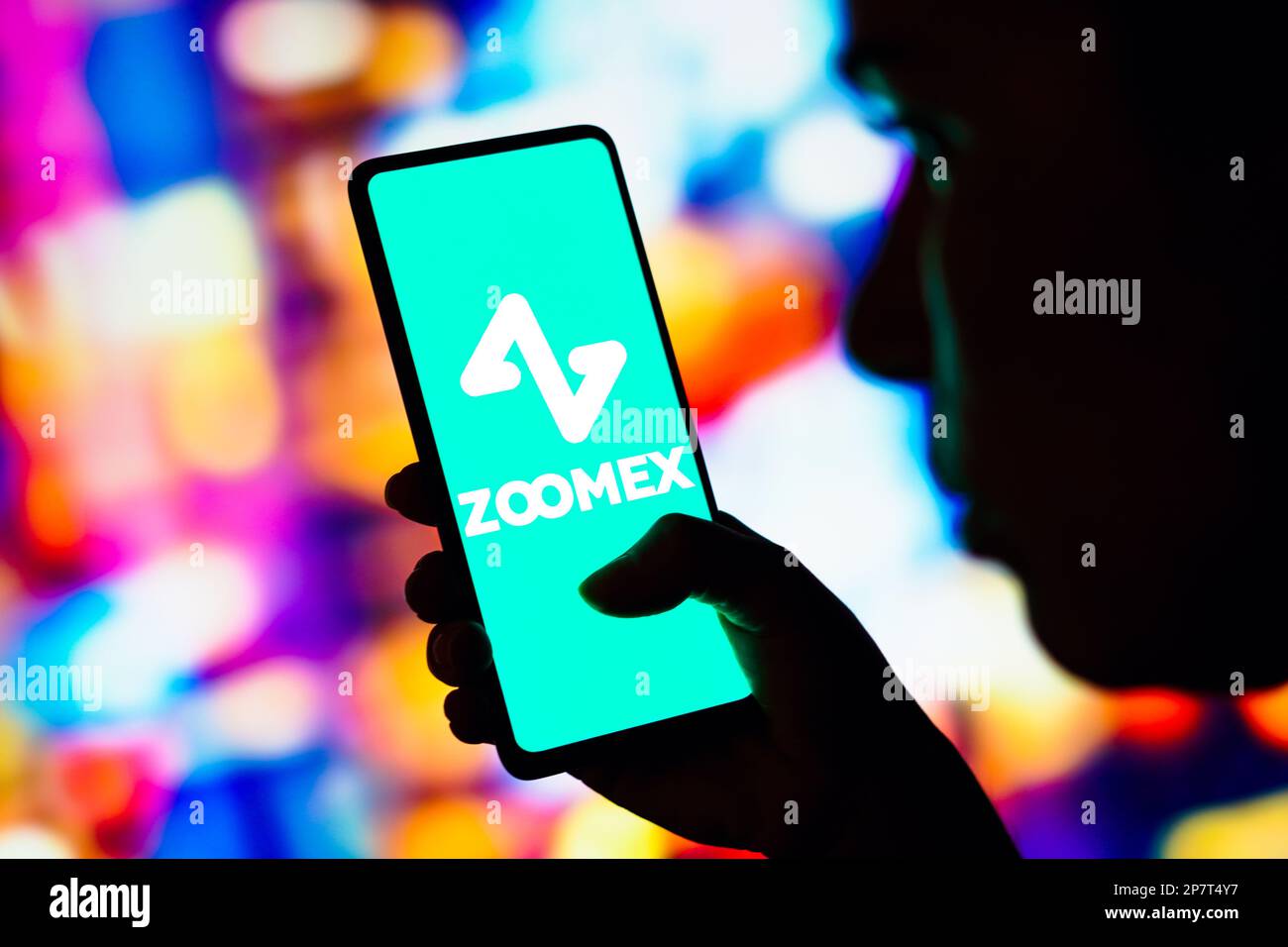 In this photo illustration, the Zoomex logo seen displayed on a ...