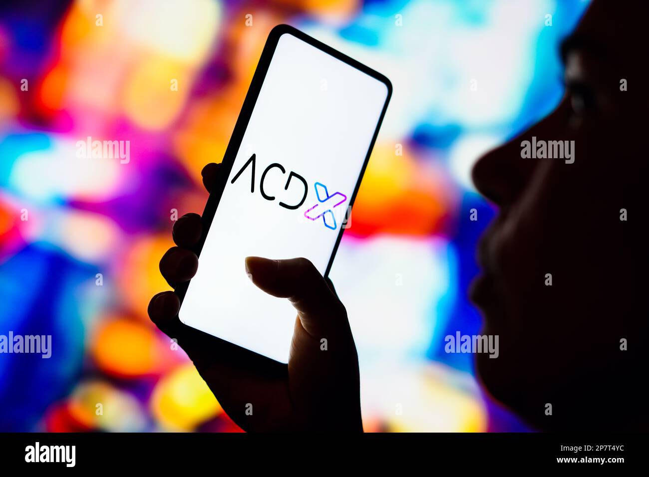 In this photo illustration, the ACDX logo seen displayed on a ...