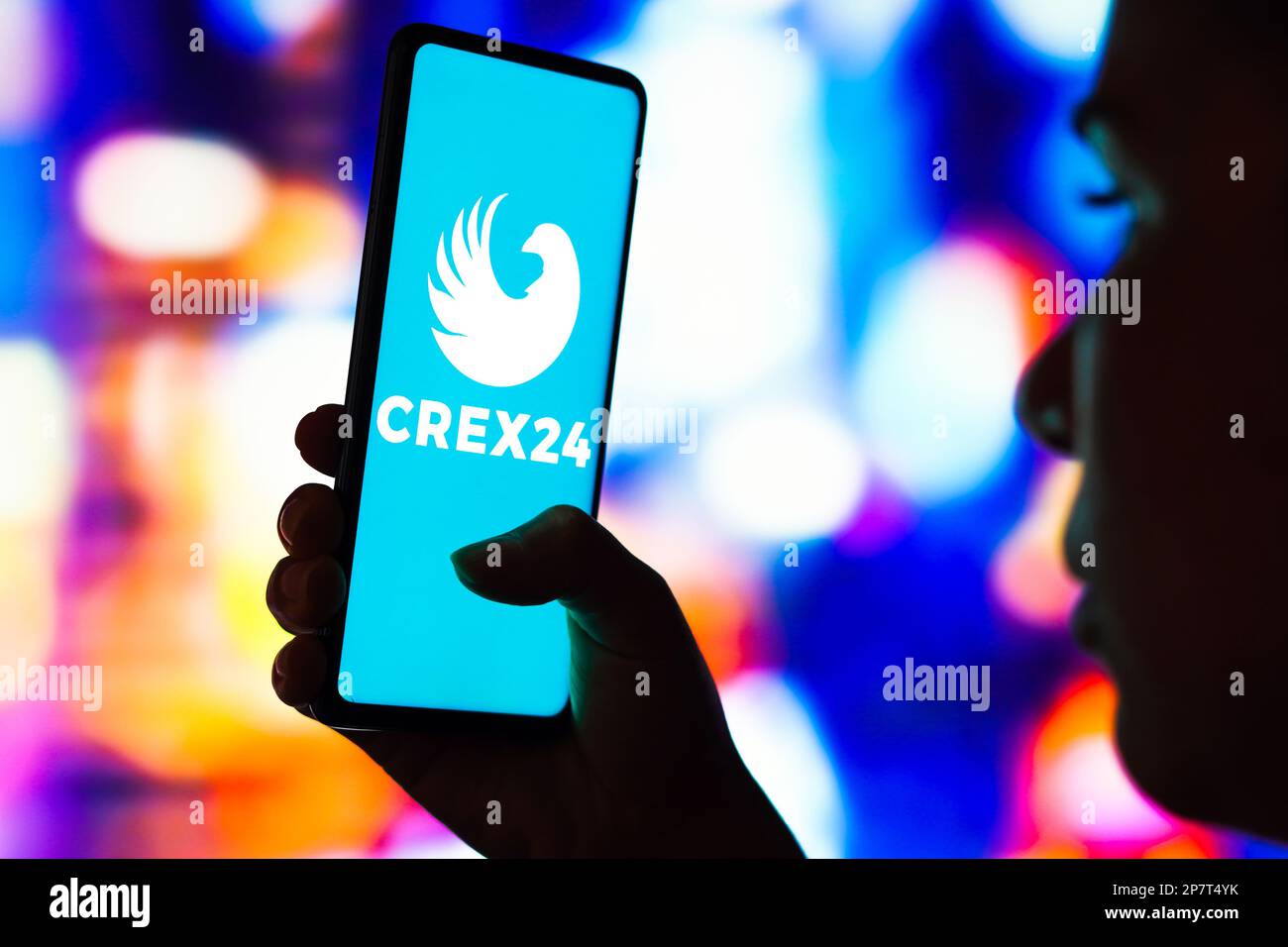 In this photo illustration, the Crex24 Exchange logo seen displayed on a smartphone Stock Photo ...