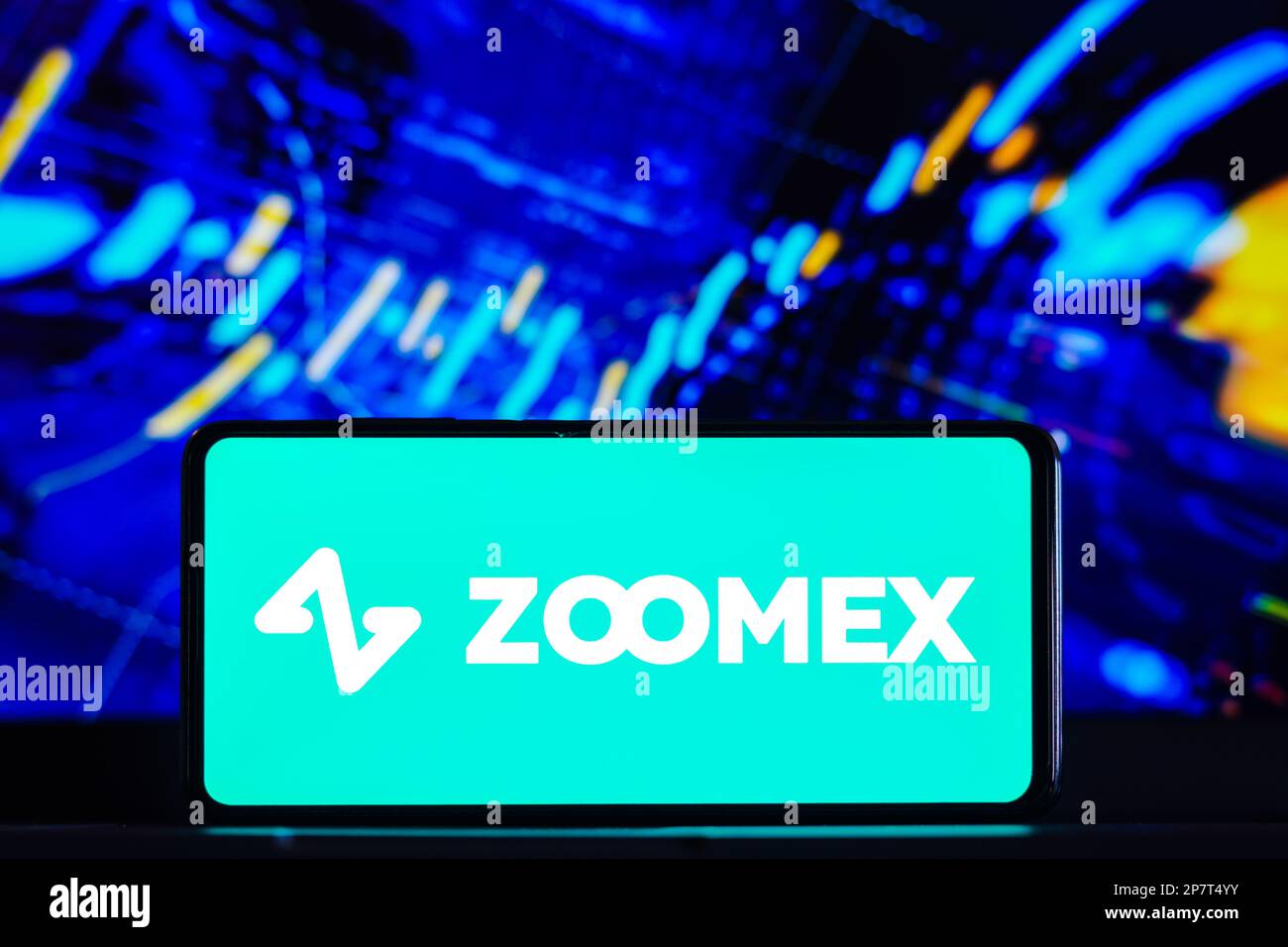 In this photo illustration, the Zoomex logo seen displayed on a ...