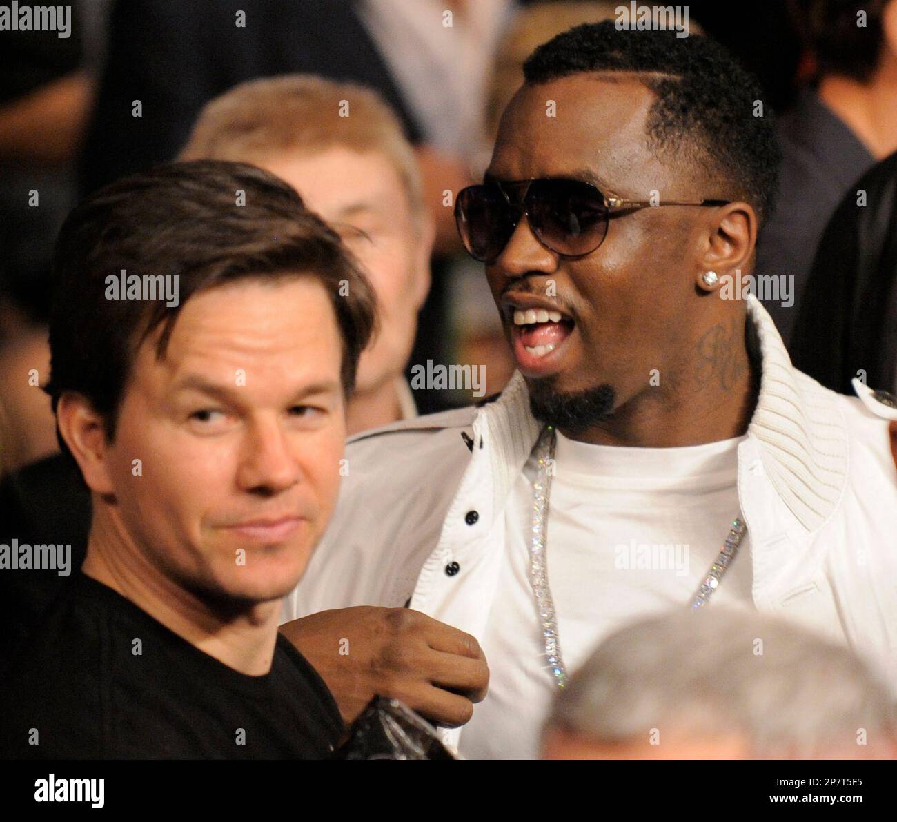 Rapper Diddy, right, joins actor Mark Wahlberg before the start of the ...