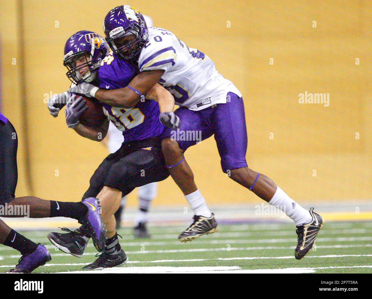 Northern Iowa's Matt Strathman, left, is tackled by Western Illinois ...