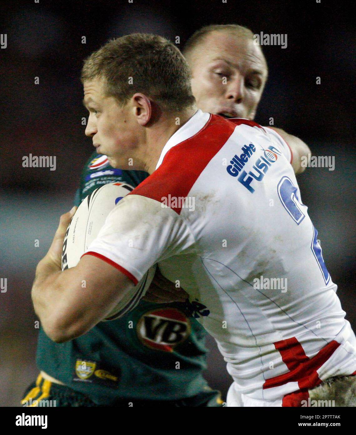 England's Peter Fox, left, is tackled by Australia's captain Darren ...