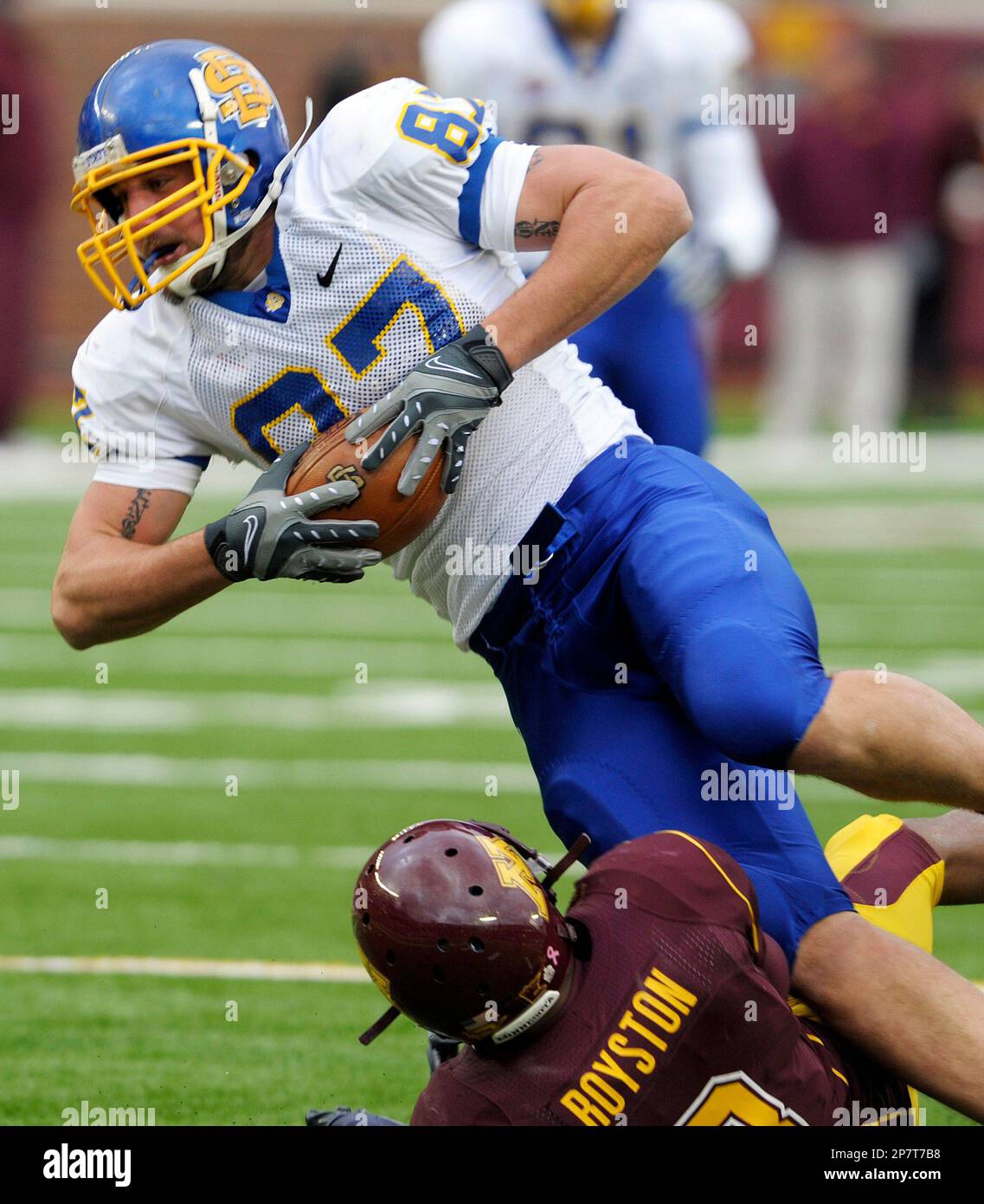 South Dakota State tight end Colin Cochart (87) is pulled down by ...