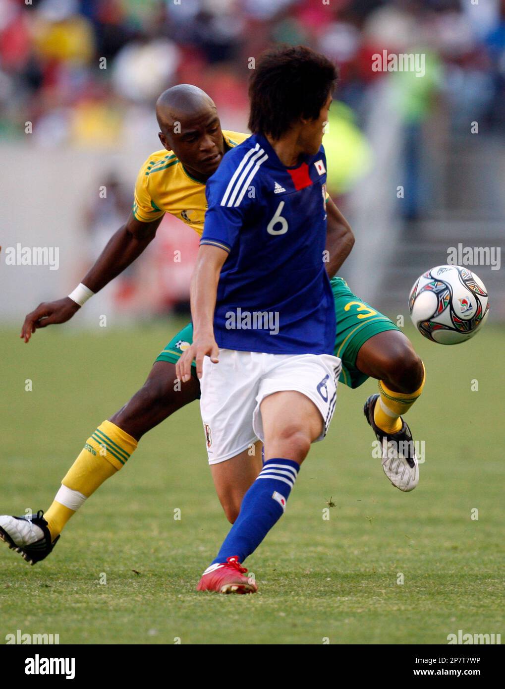 South Africa's Tsepo Masilela, back, attacks against Japan's Komno ...