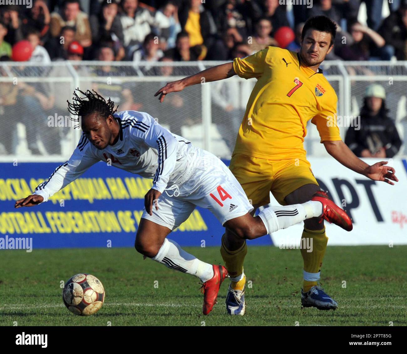 Canada's Jaime Peters, left, is challenged by Macedonia's Dusan Savic ...