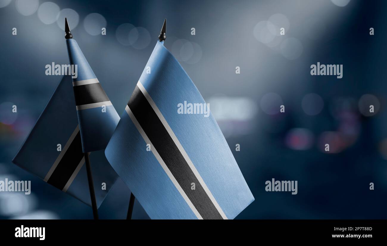 Small flags of the Botswana on an abstract blurry background Stock ...