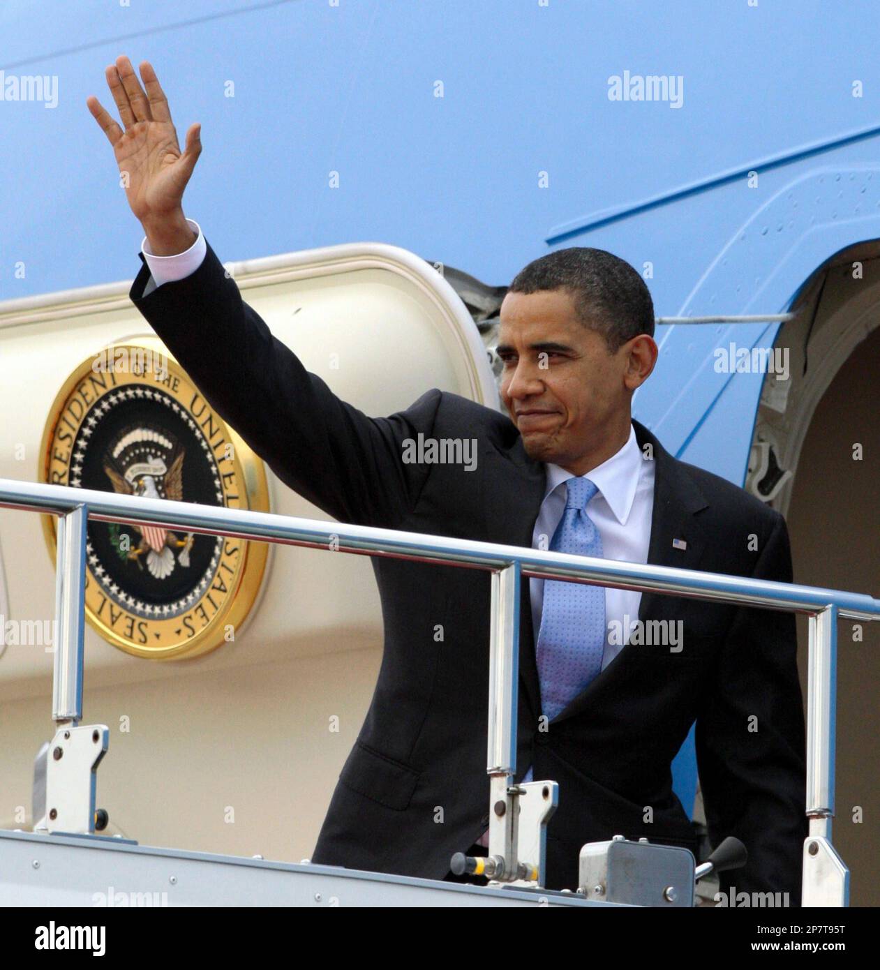 U.S. President Barack Obama waves as he leaves Japan on Air Force One ...