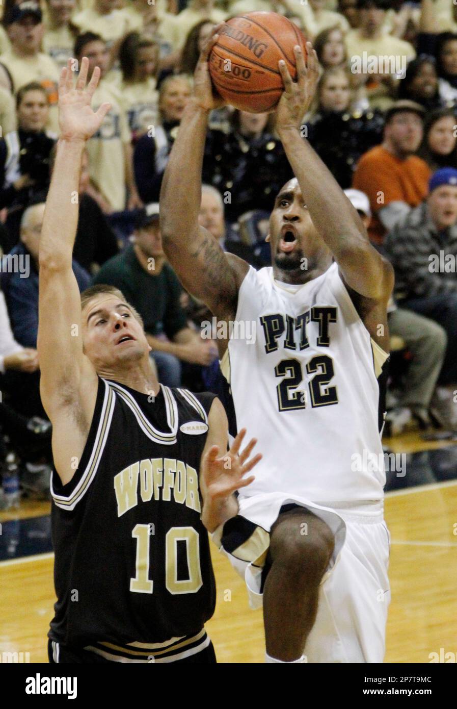 Pittsburgh's Brad Wanamker, right, shoots over Wofford's Kevin Giltner ...