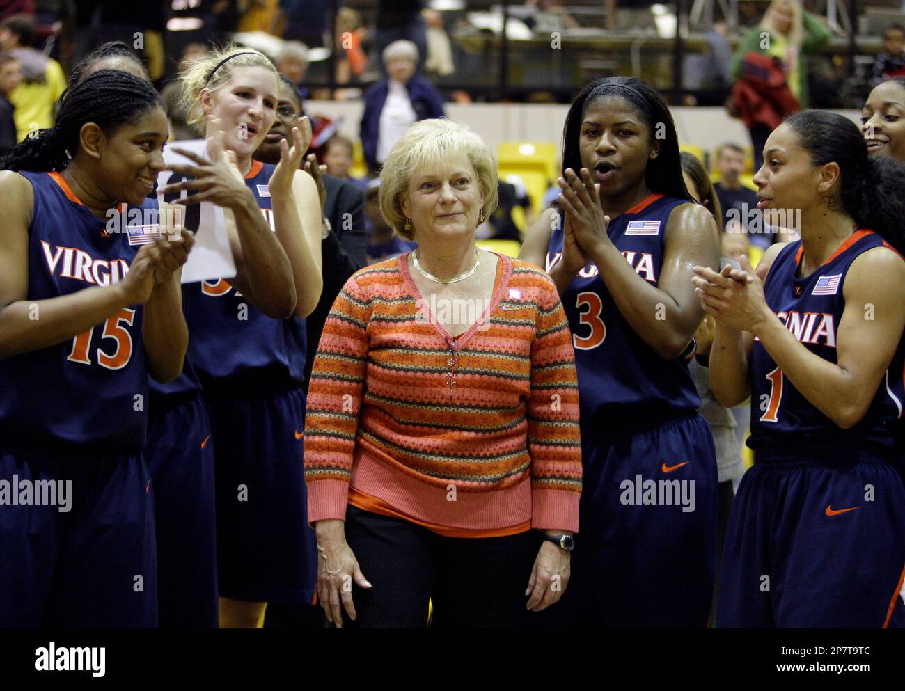 Virginia coach Debbie Ryan, center, is applauded by her team after ...