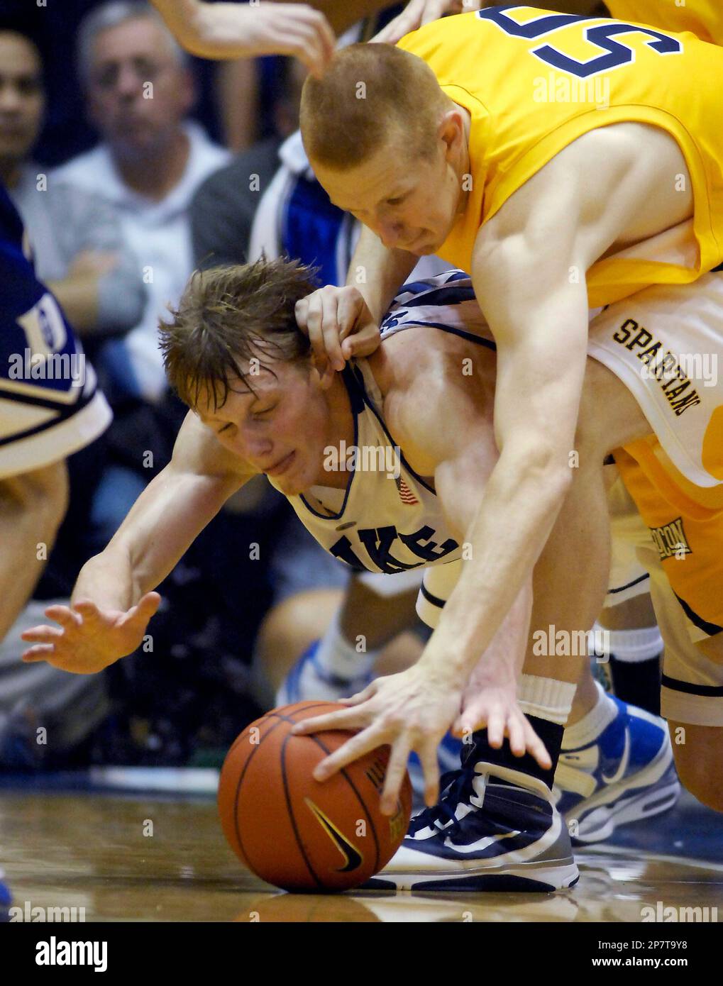 Duke's Kyle Singler (12) battles for the ball with North Carolina ...