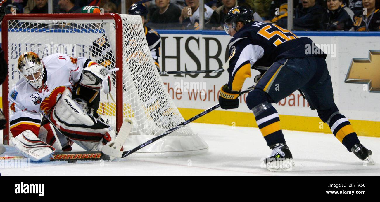 Buffalo Sabres' Jochen Hecht (55) of Germany shoots the puck on Calgary ...