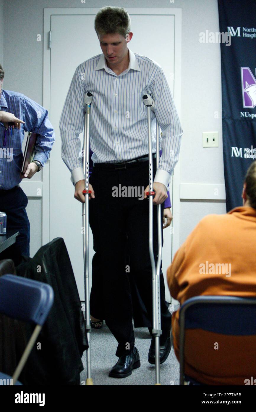 Northwestern's Kevin Coble leaves after a news conference before an ...