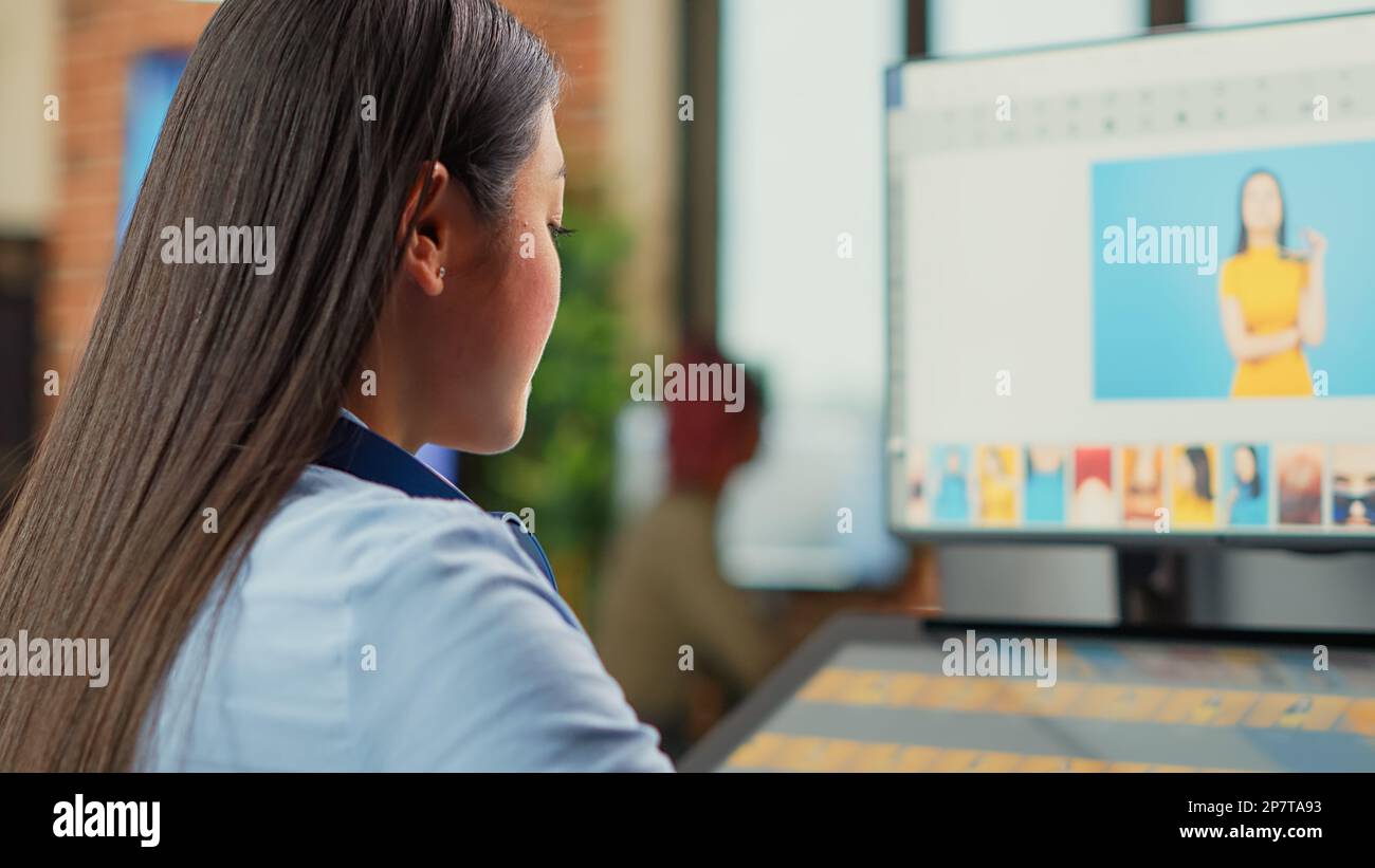 Woman freelancer using retouching software on computer, working on ...