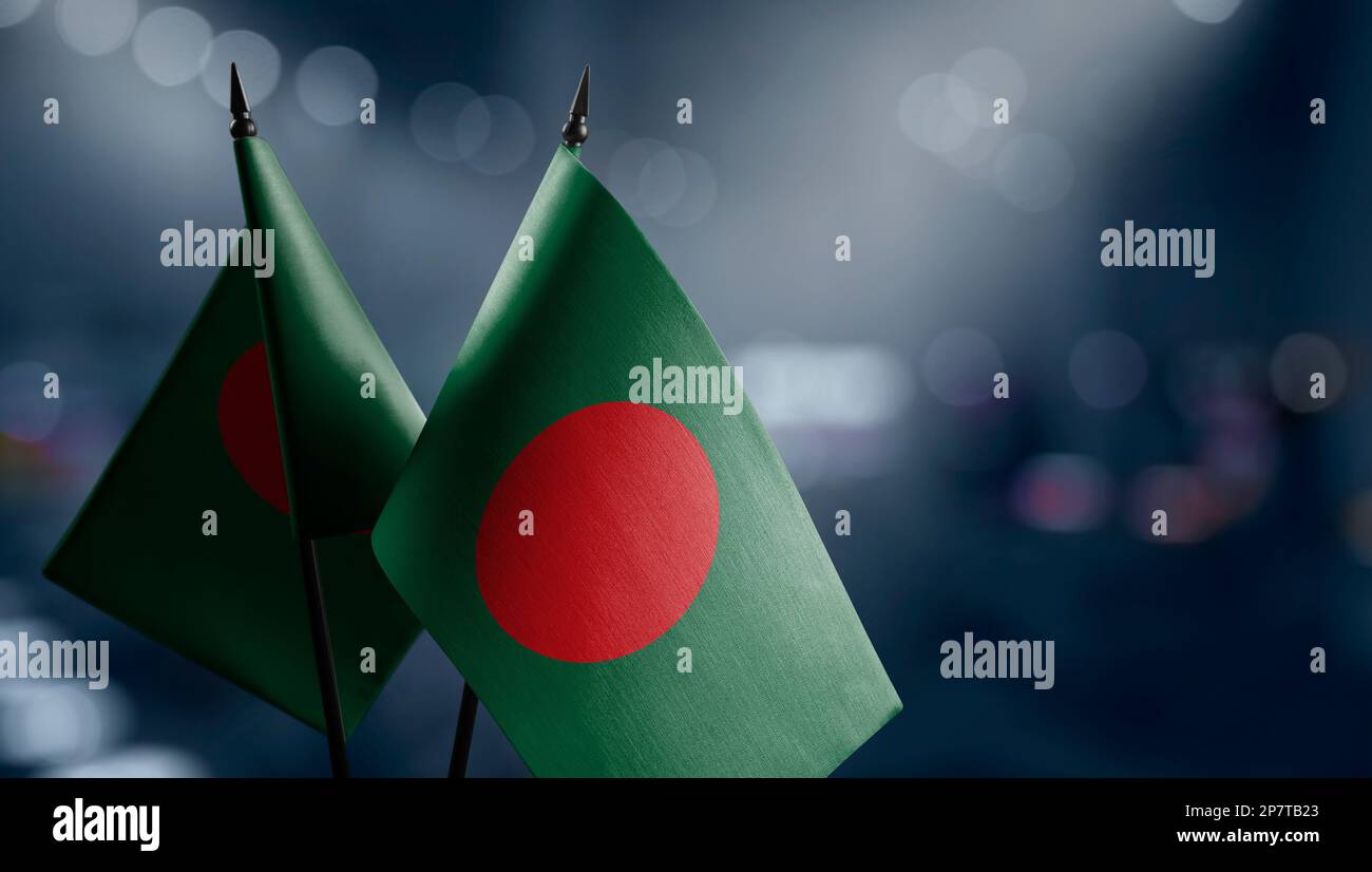Small flags of the Bangladesh on an abstract blurry background Stock ...