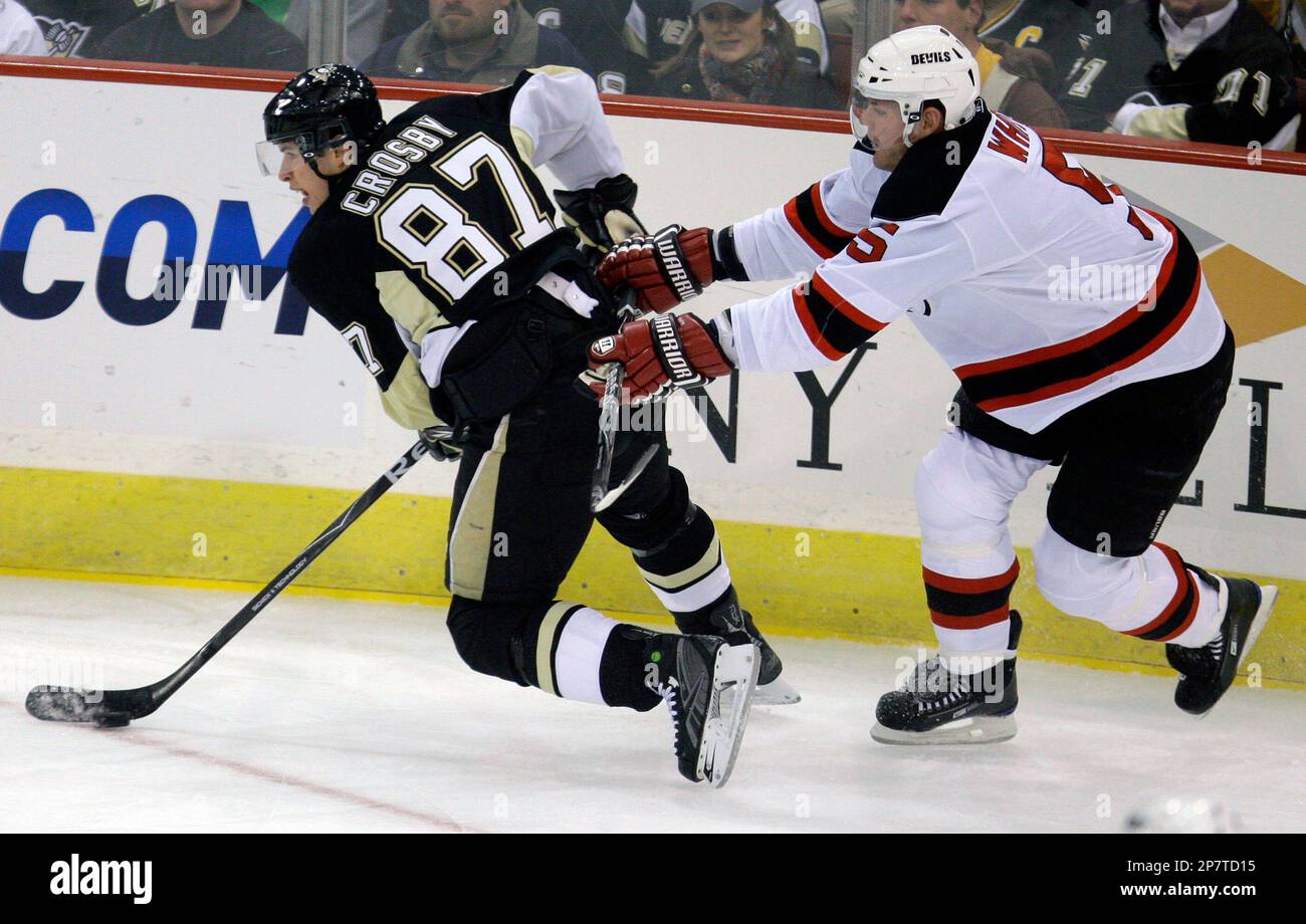 Pittsburgh Penguins' Sidney Crosby, left, is shoved by New Jersey ...