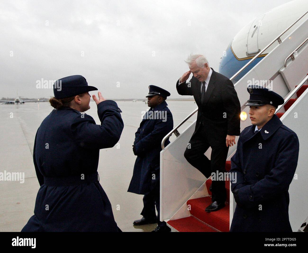 Defense Secretary Robert Gates steps off the plane as he arrives at ...